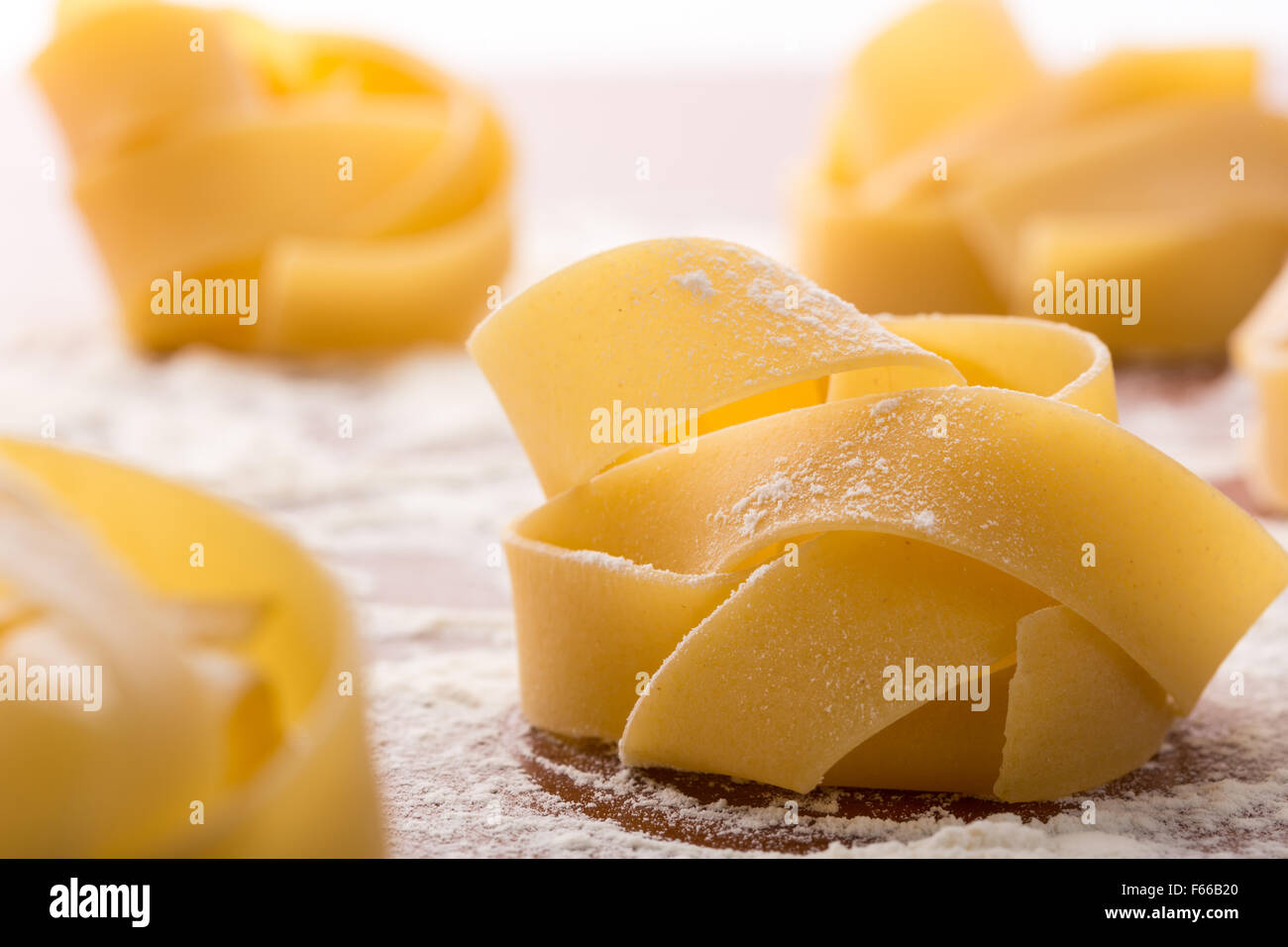 Pasta rolls with flour Stock Photo - Alamy