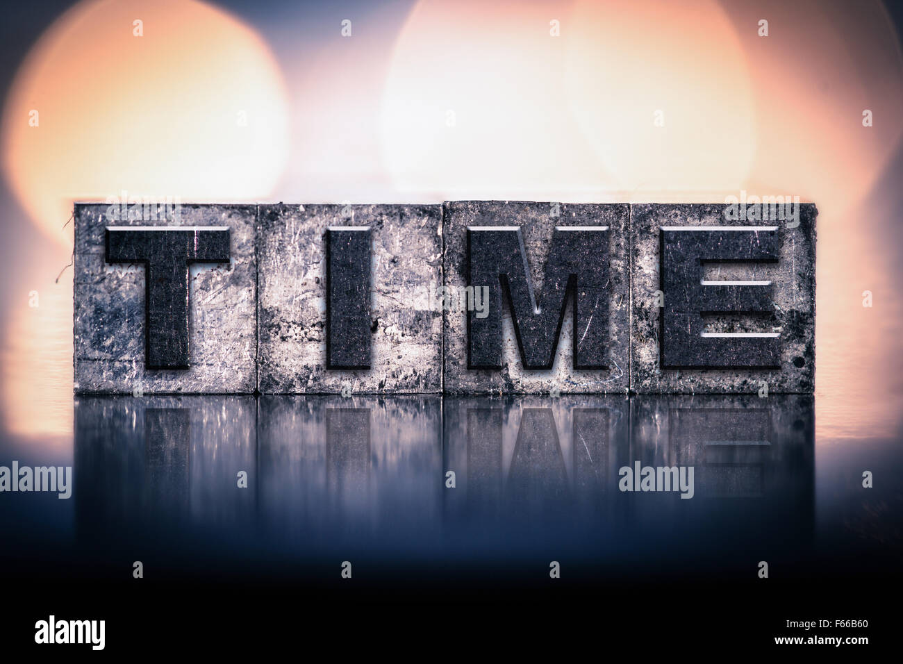 The word "TIME" written in vintage ink stained letterpress type Stock ...