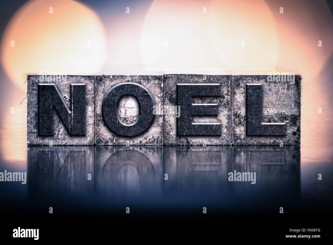 The word "NOEL" written in vintage ink stained letterpress type Stock ...