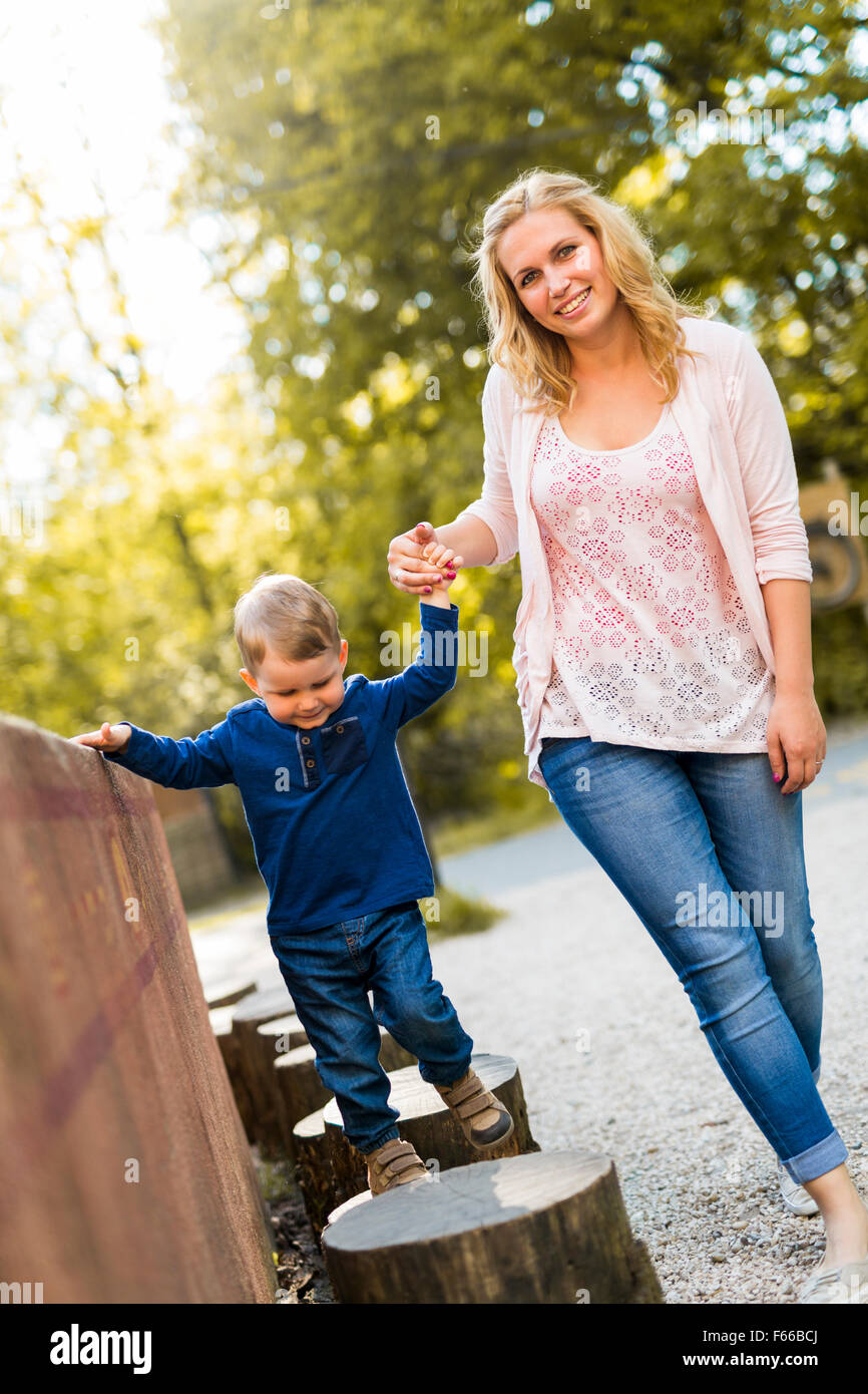 Boy walking with mother hi-res stock photography and images - Alamy