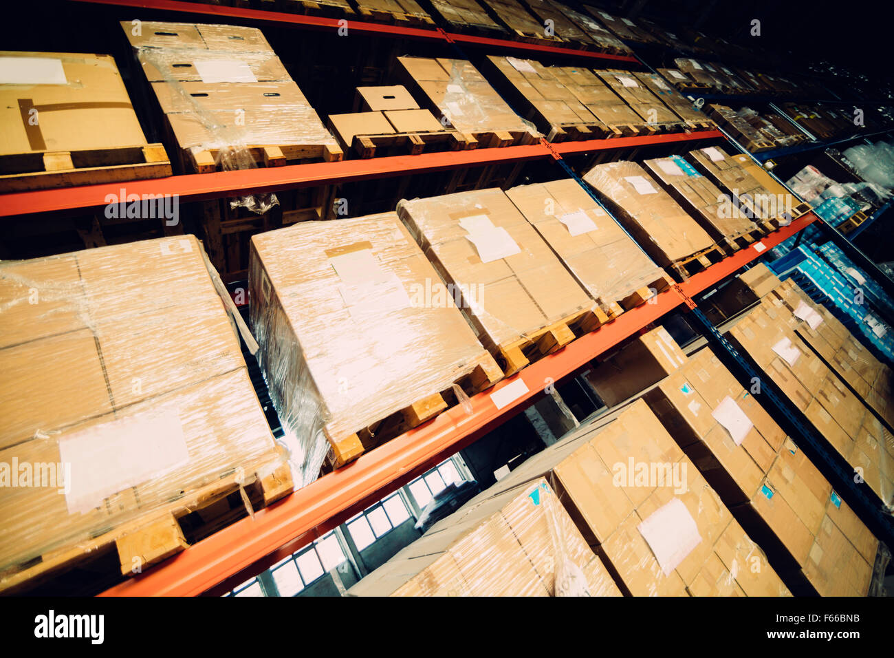 Pallets storing boxes in an industrial warehouse Stock Photo - Alamy