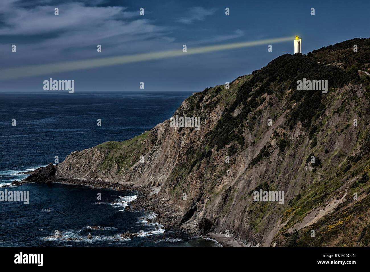Lighting lighthouse on the cliff Stock Photo - Alamy