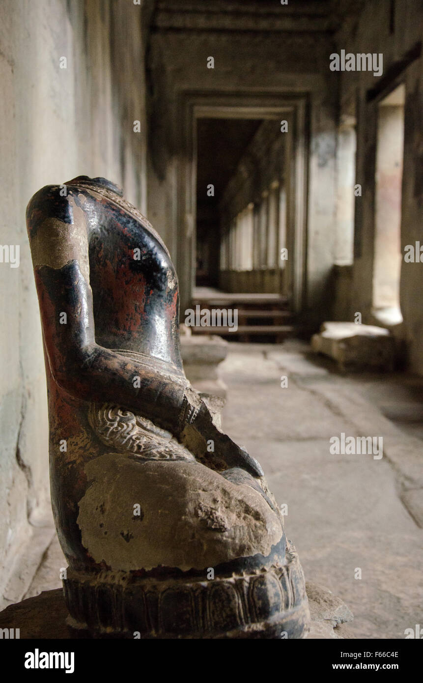 Old statue in corridor of abandoned temple Stock Photo - Alamy