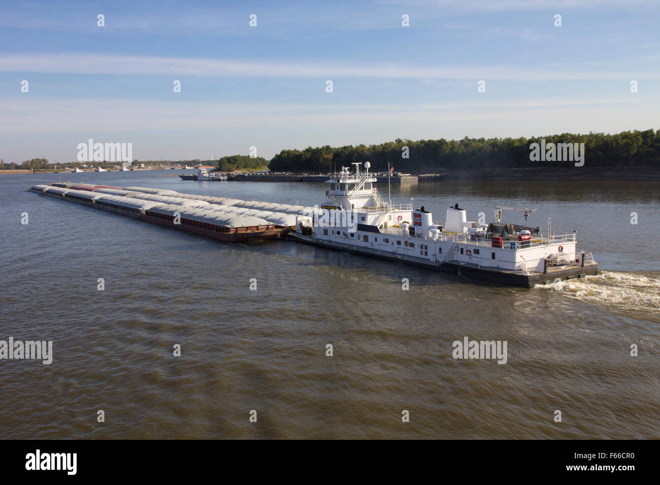 Large, powerful flat-bottomed towboats are used to push barges on the ... Large, powerful flat-bottomed towboats are used to push barges on the ...