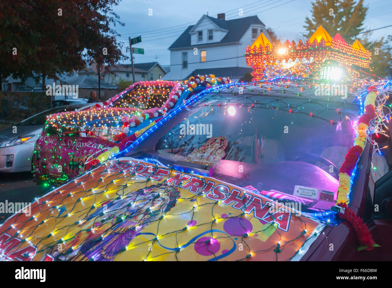 Cars and floats festooned with lights parade down Liberty Avenue in the ...