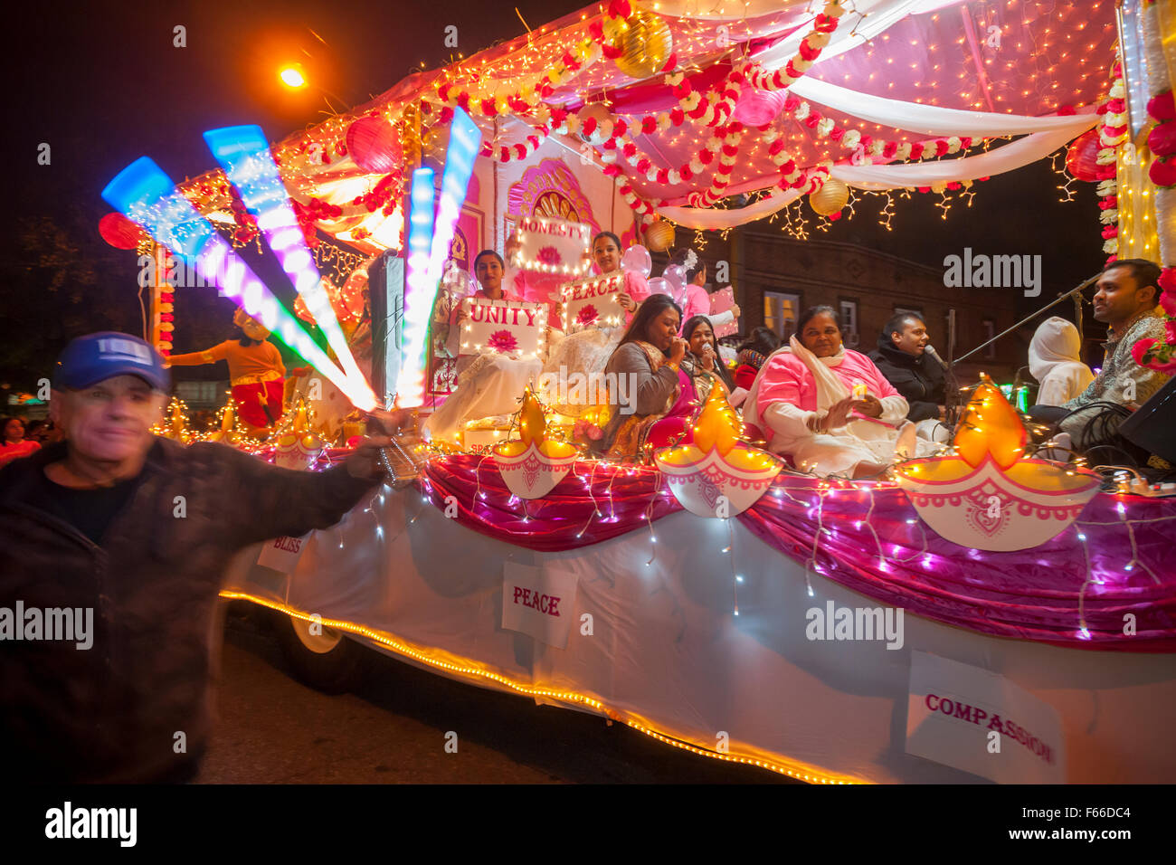 Cars and floats festooned with lights parade down Liberty Avenue in the ...