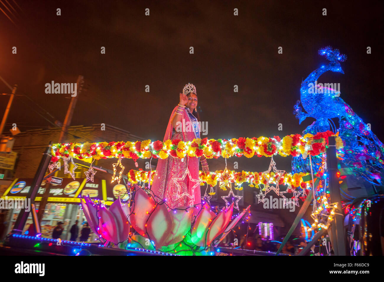 Cars and floats festooned with lights parade down Liberty Avenue in the ...