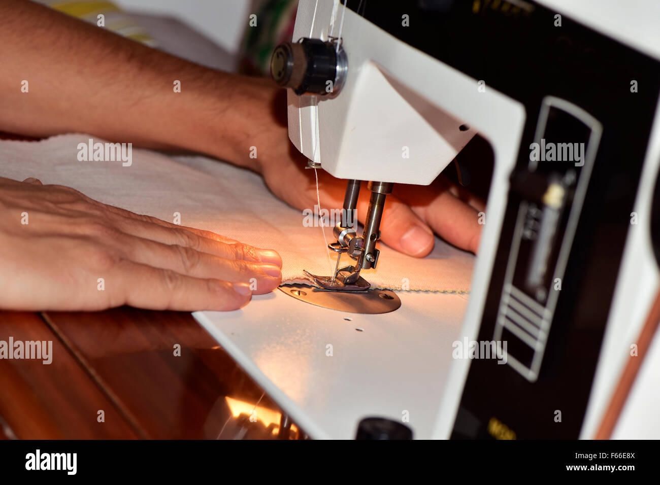 Man sewing hi-res stock photography and images - Alamy