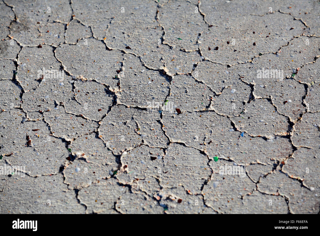 Cracking concrete with embedded glass shards Stock Photo - Alamy