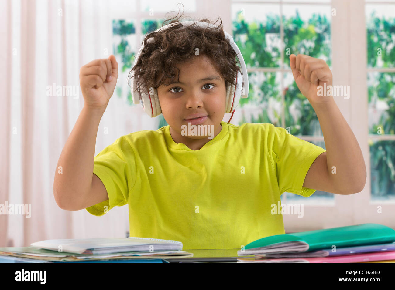 boy is doing homework and listening music Stock Photo - Alamy
