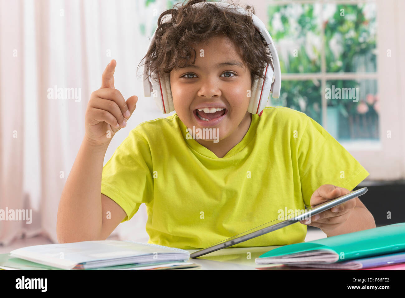 boy is doing homework and listening music Stock Photo - Alamy