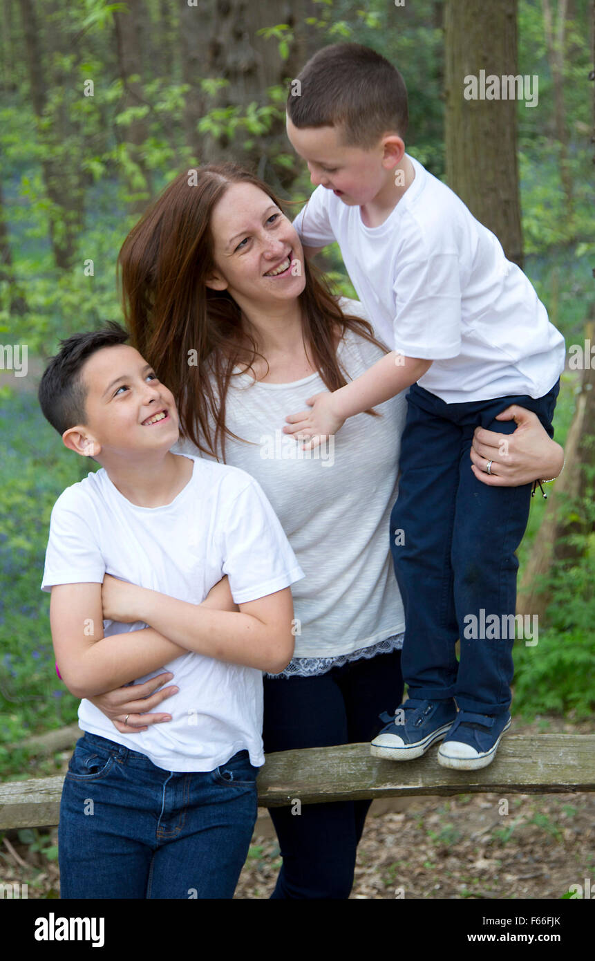 Mother & Sons out in the woods Stock Photo - Alamy