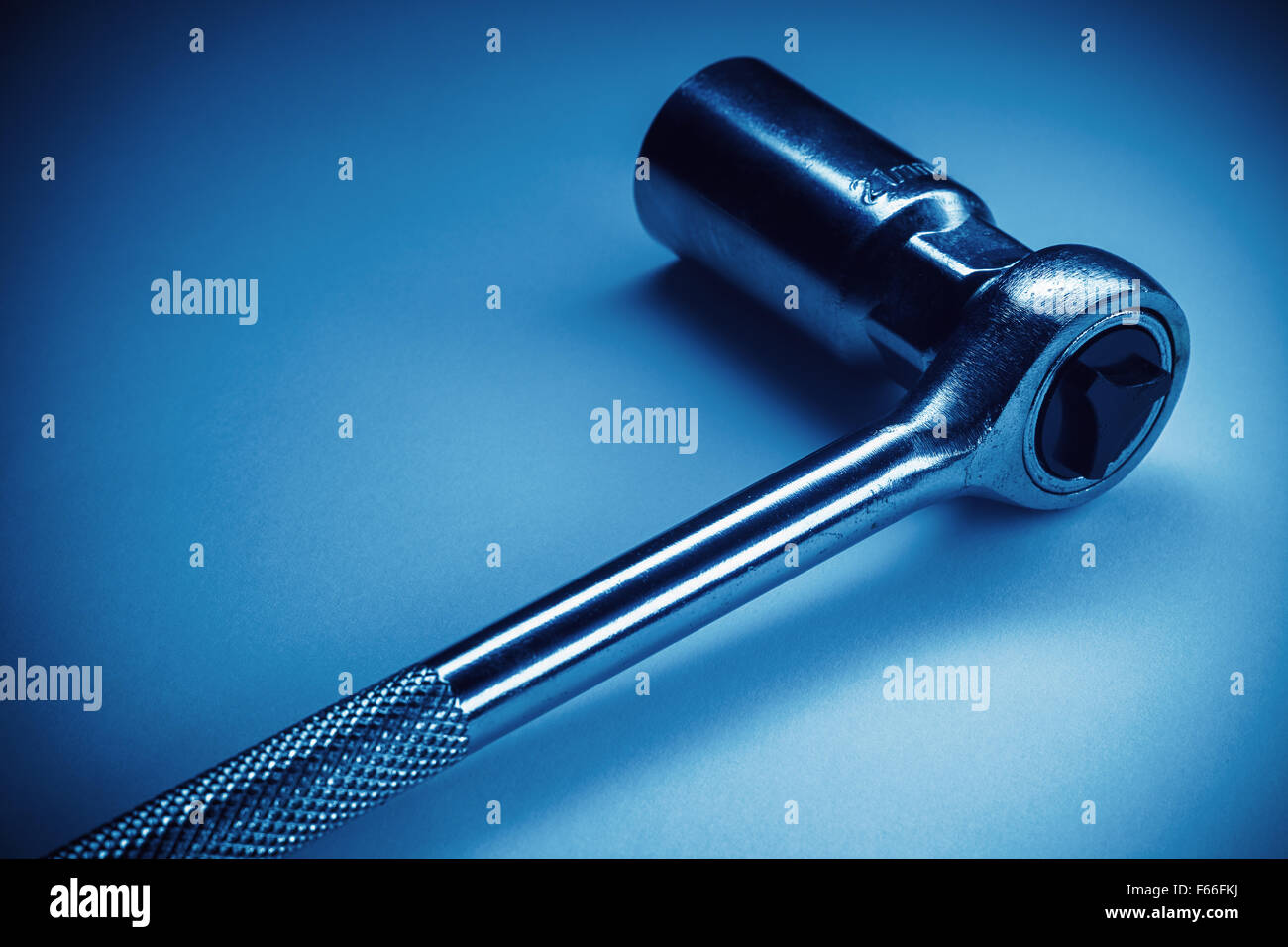 Modern wrench with variable heads, in blue illumination Stock Photo - Alamy