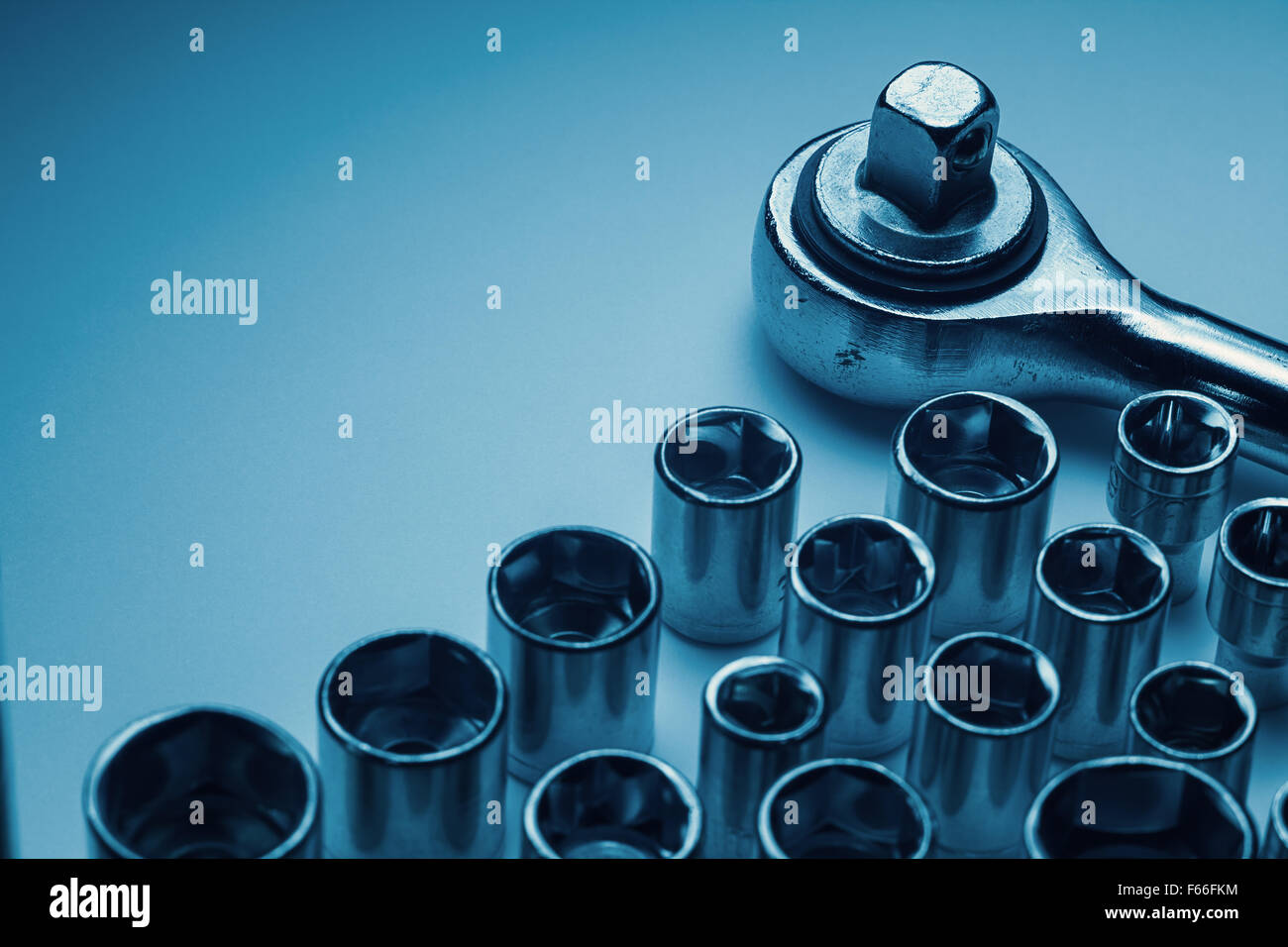 Modern wrench with variable heads, in blue illumination Stock Photo - Alamy