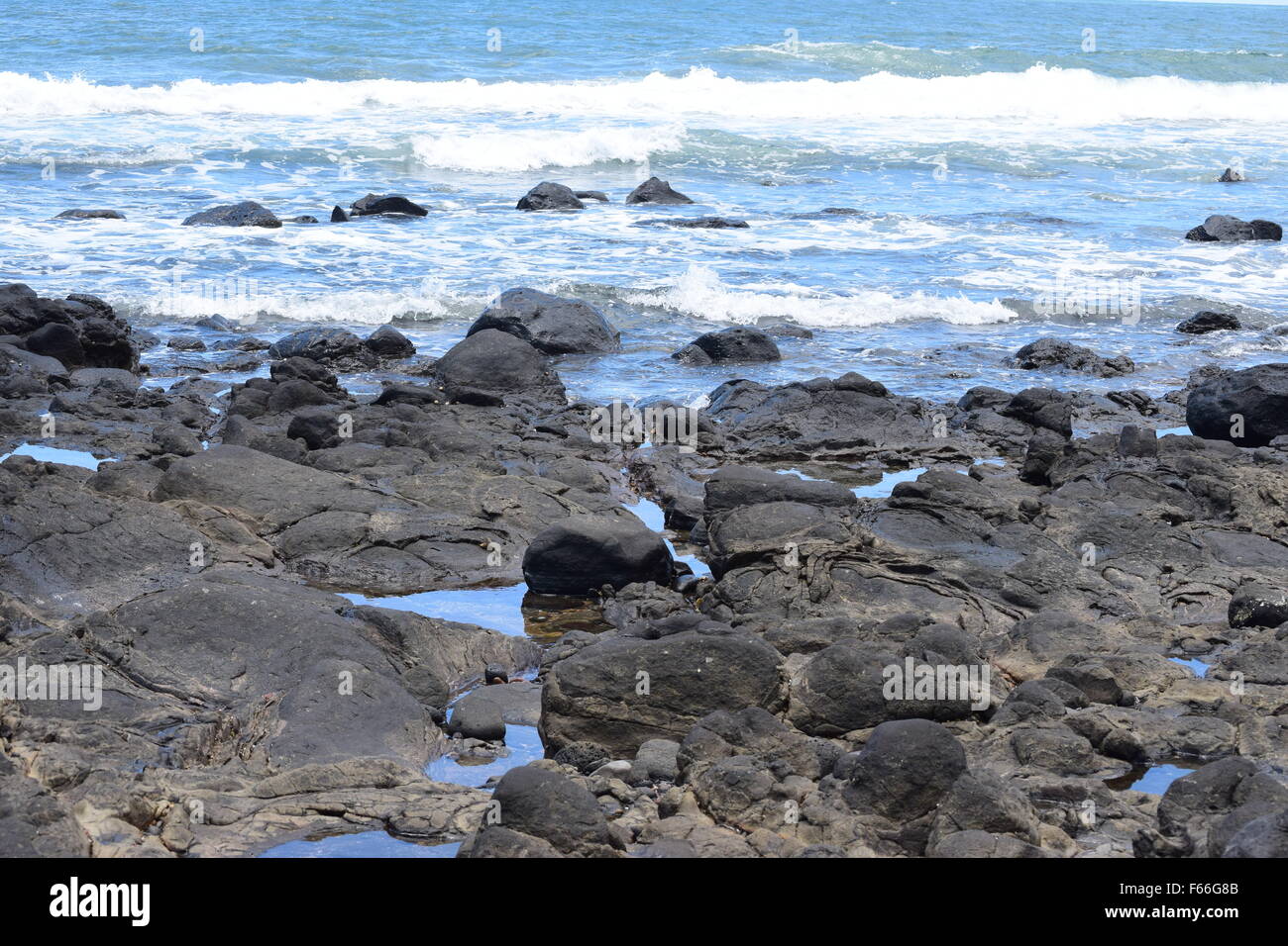 Water rolling over rocks hi-res stock photography and images - Alamy