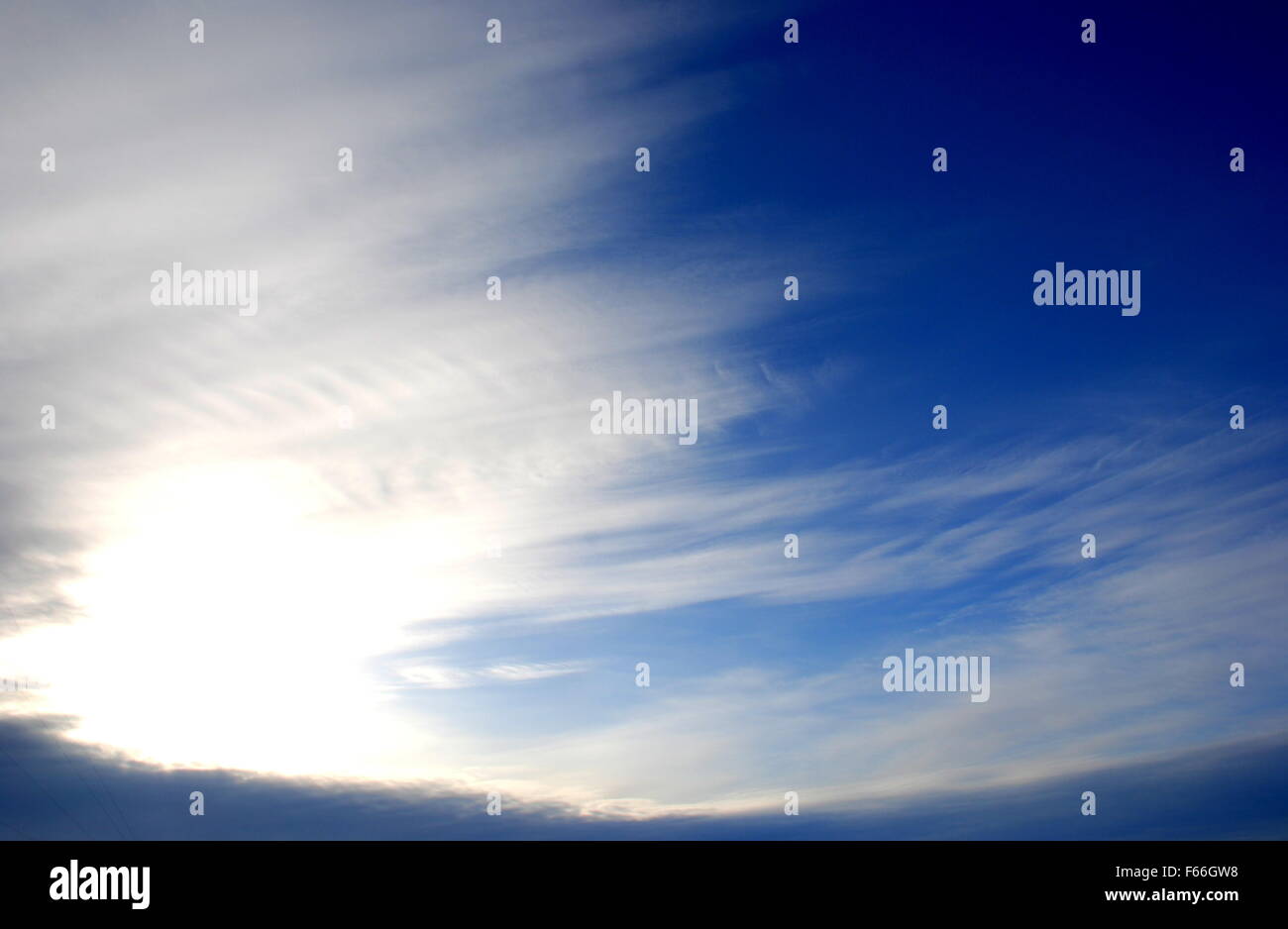 Wispy Clouds & Sun Stock Photo - Alamy