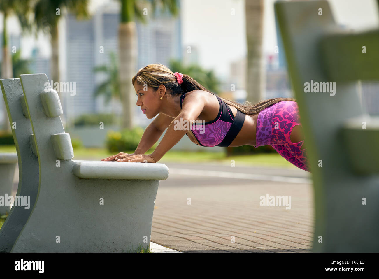 Young african american woman training chest and exercising early ...