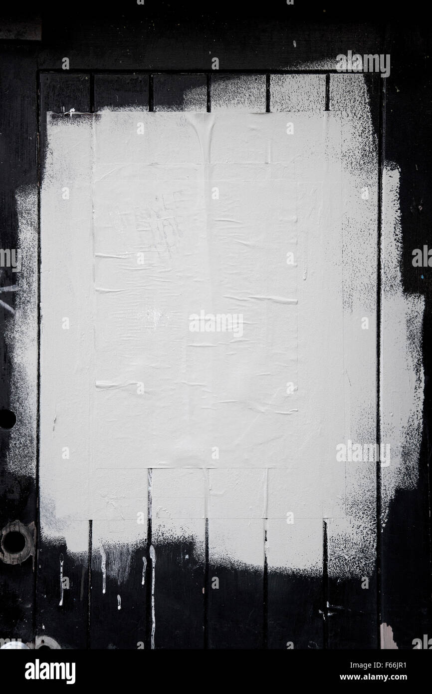 Rough white paint rolled over a black wooden textured background Stock ...