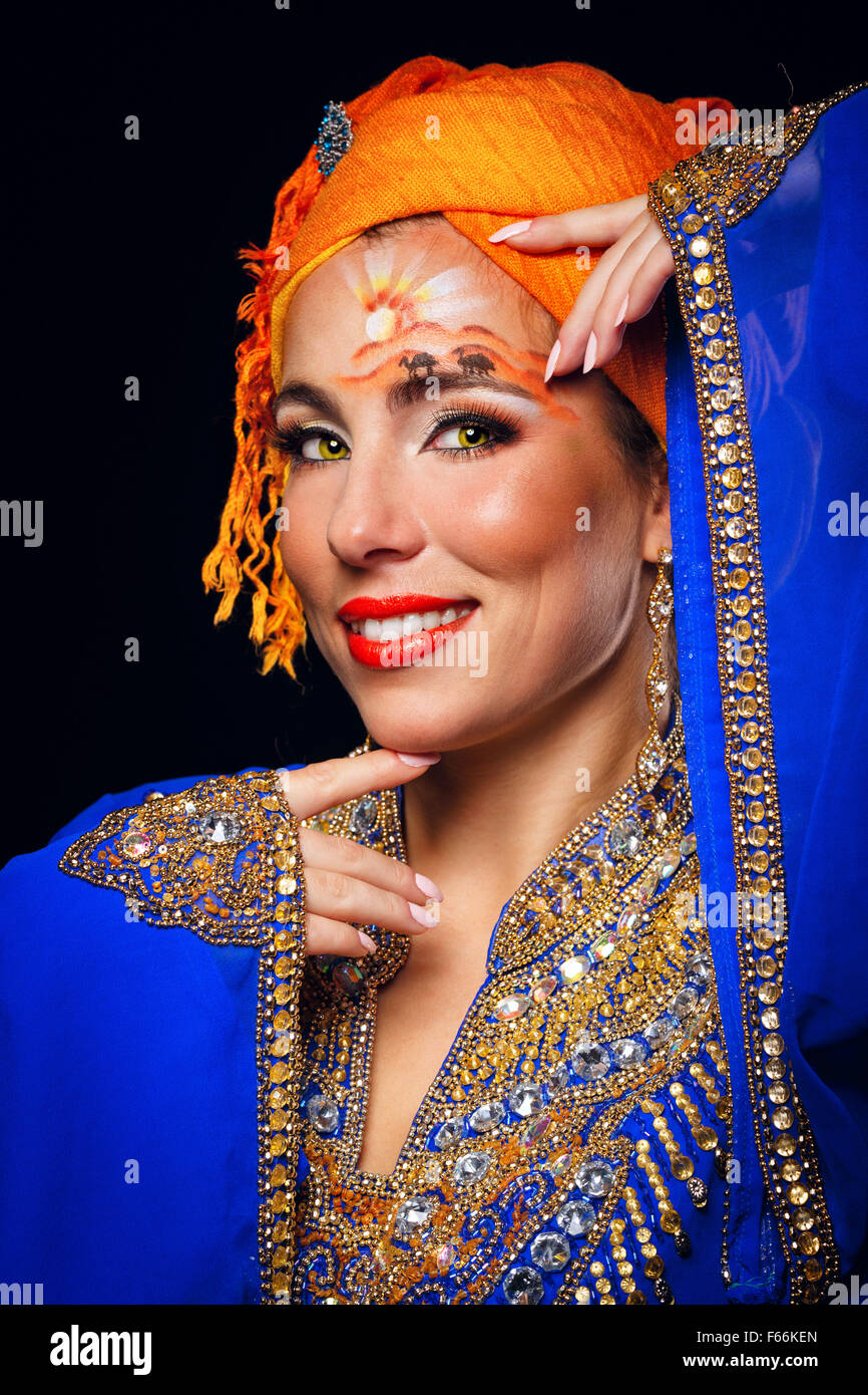 Portrait of eastern beauty with face art and national costumes. Girl ...