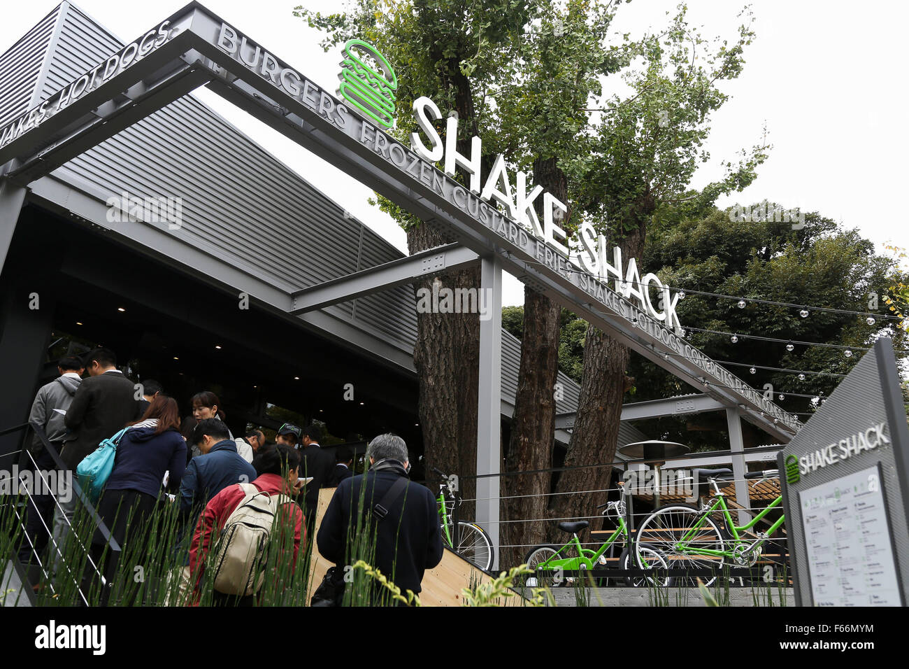 People wait in line to enter the new burger restaurant Shake Shack in ...