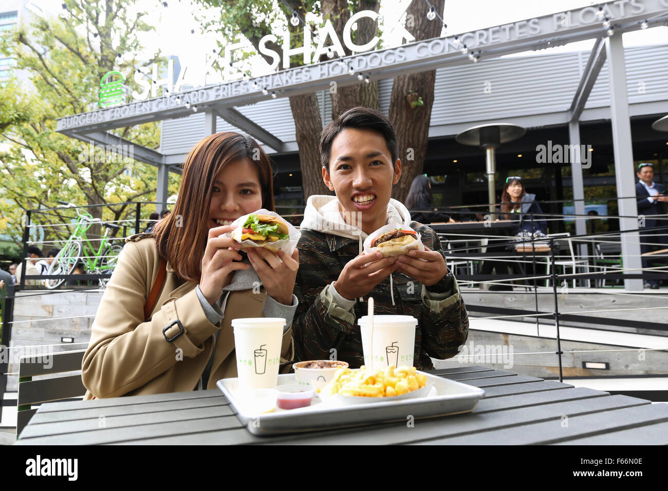 Customers enjoy eating at the new restaurant Shake Shack in Meiji-Jingu ...