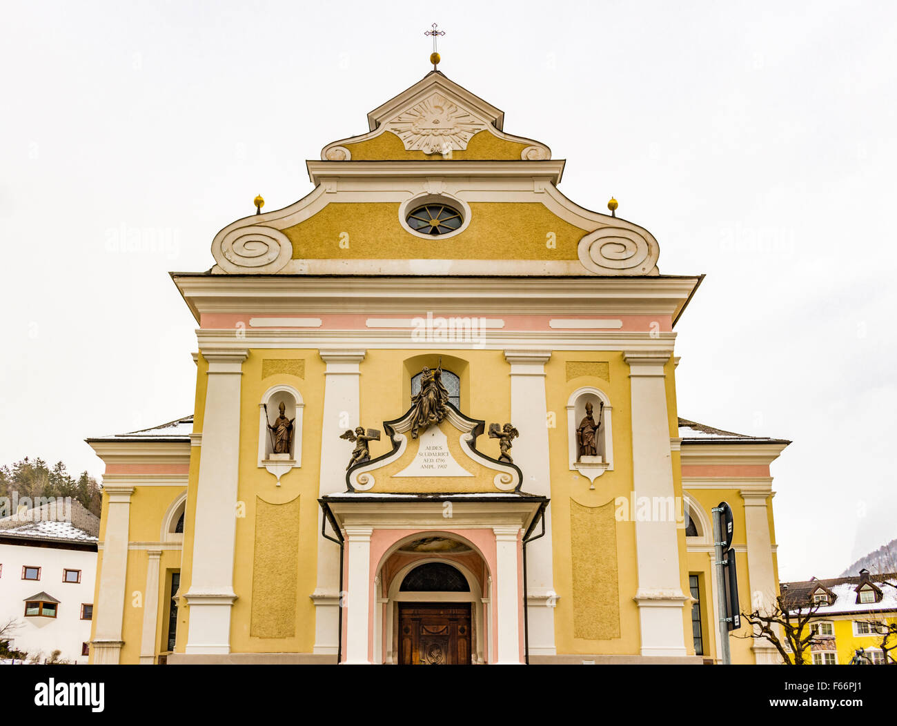 Yellow and orange Neoclassical style facade of Catholic Parish Church ...