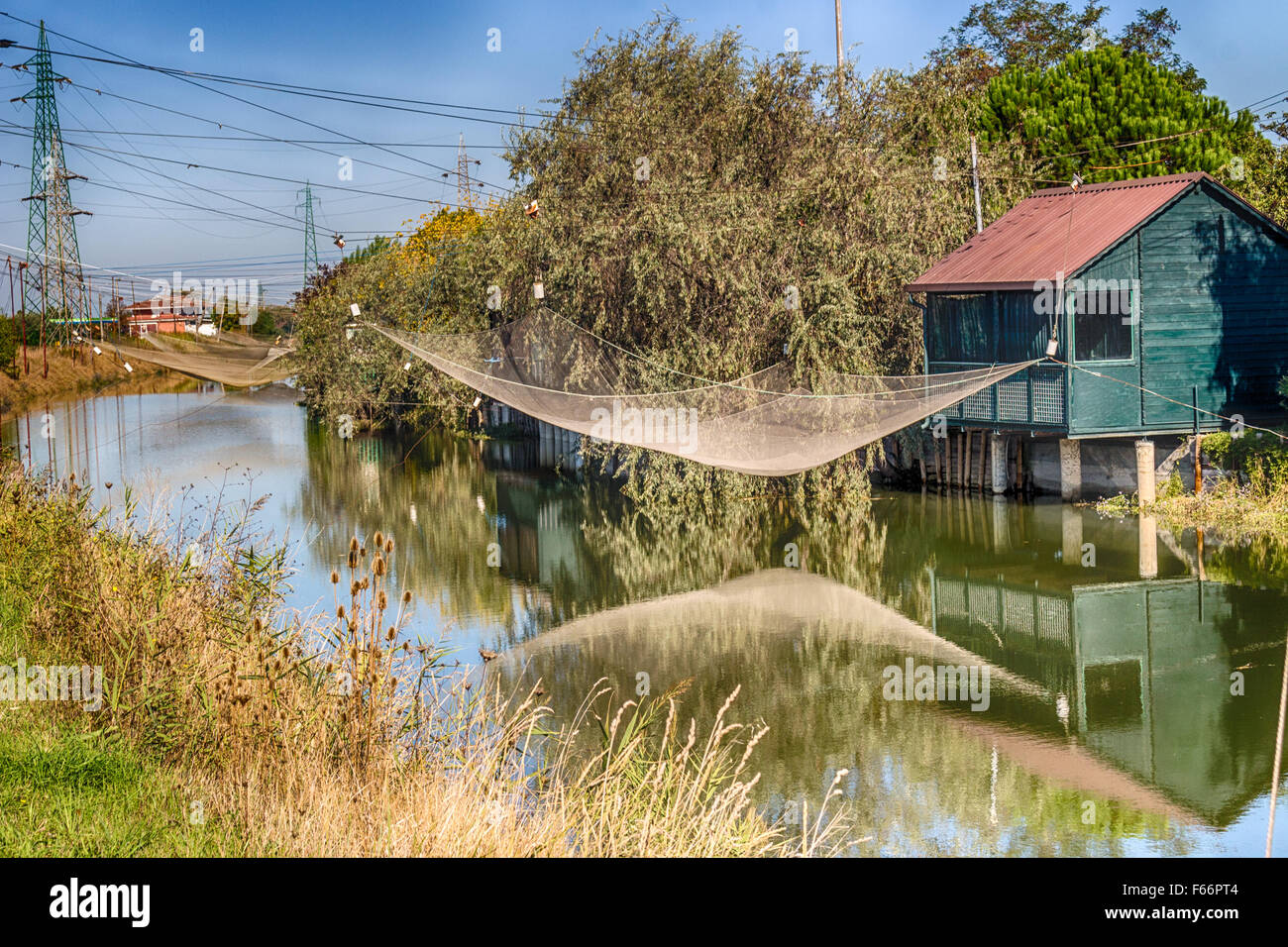 fishing hut with fishing net on hoist Stock Photo - Alamy
