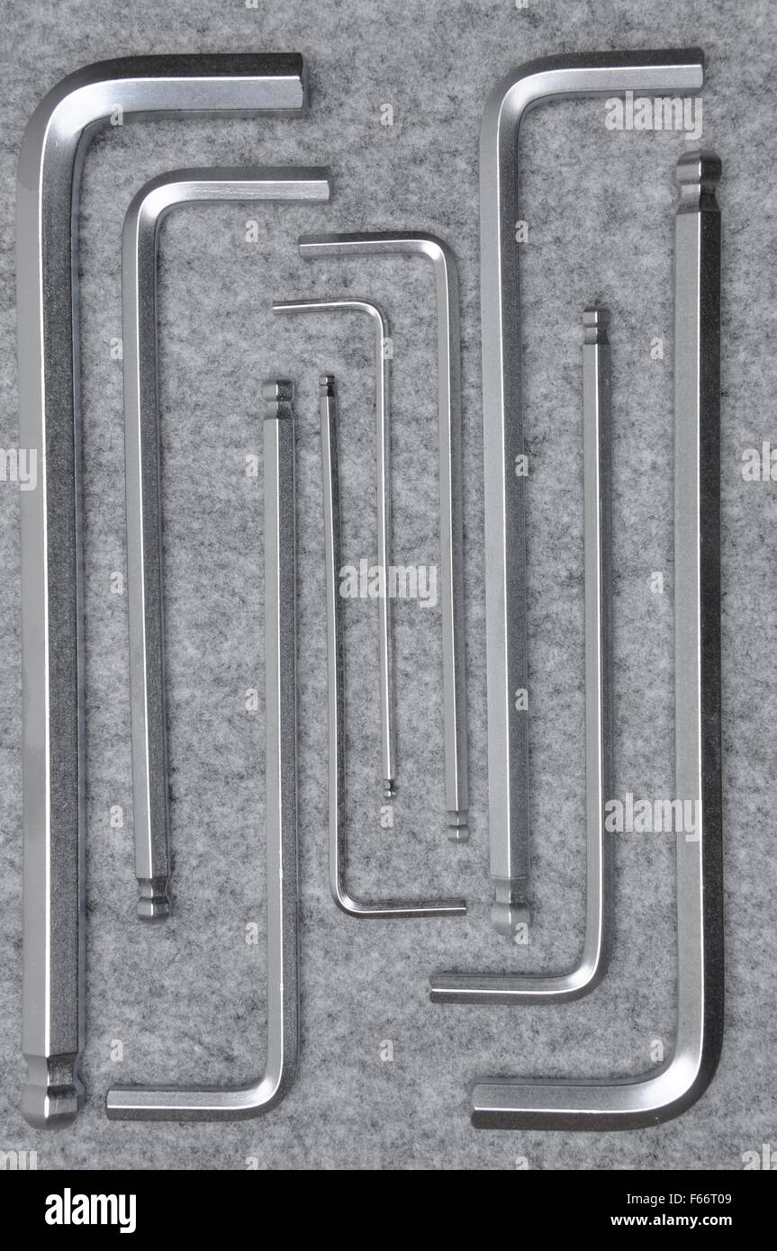 Allen keys on grey felt background Stock Photo - Alamy