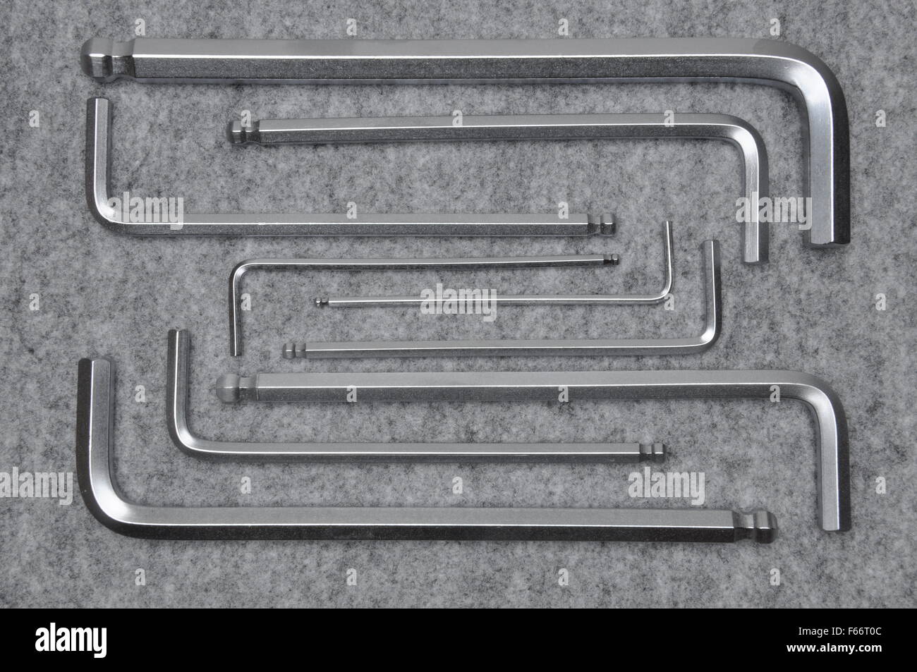Allen keys on grey felt background Stock Photo - Alamy