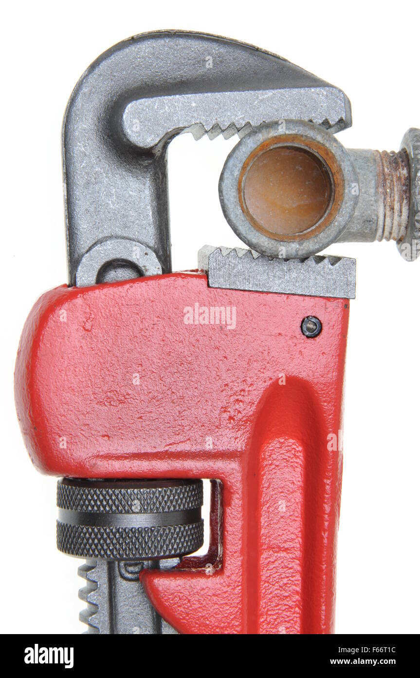 Red plumbers pipe wrench and plumbing component isolated on white ...