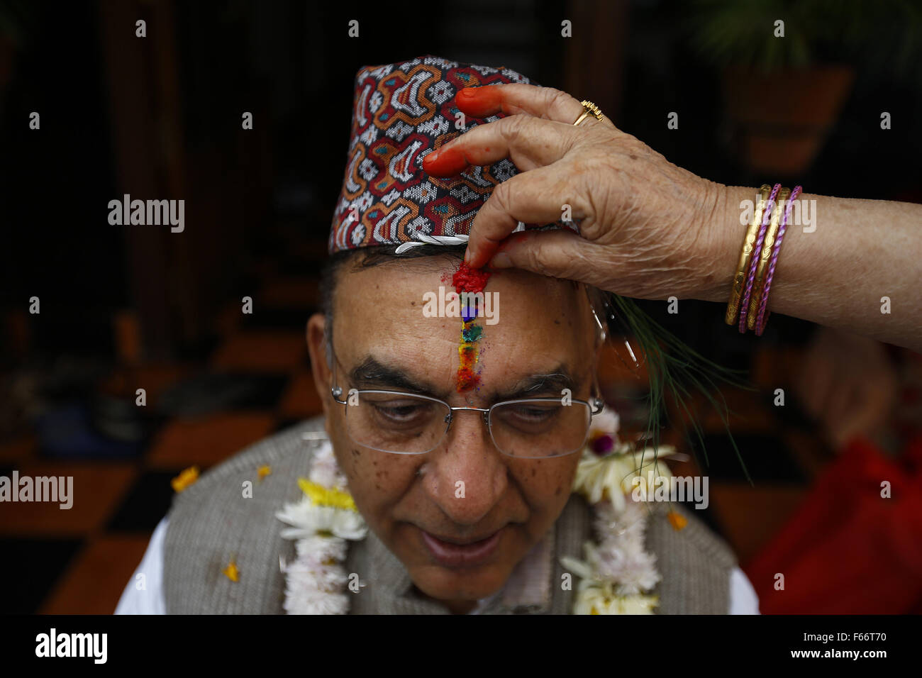 Kathmandu, Nepal. 13th November, 2015. A man being applied with ...