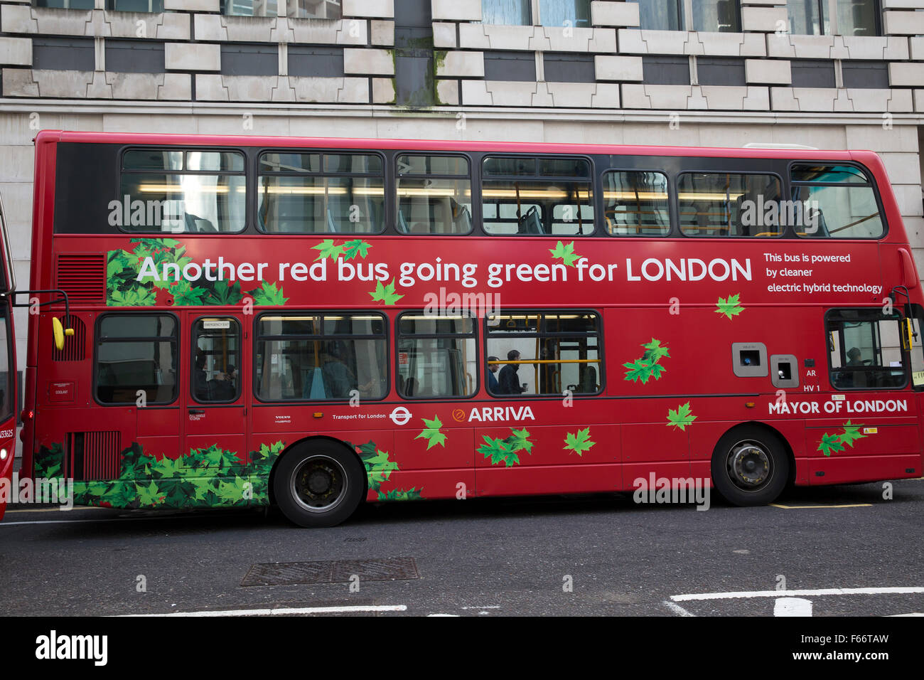 Another red bus going green for London Stock Photo - Alamy