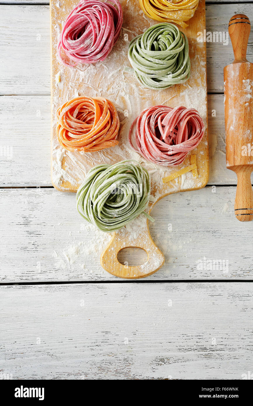 homemade color pasta on board, top view Stock Photo - Alamy