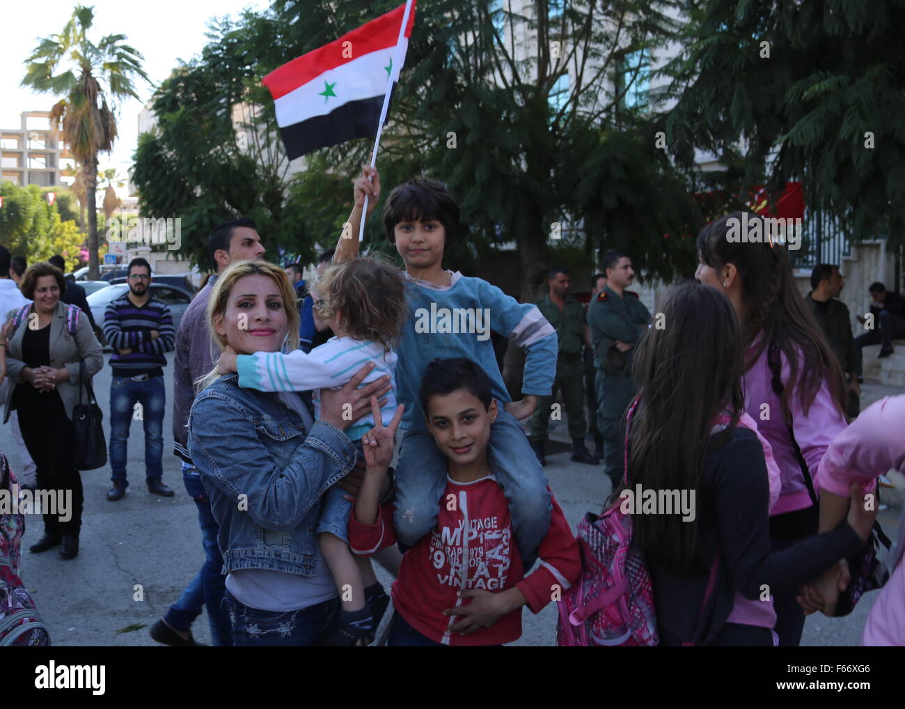 Tartus, Syria. 13th Nov, 2015. Syrian people participate in a rally ...