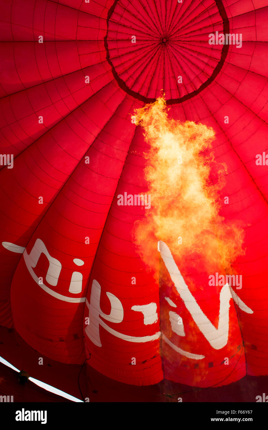 Gas flame heating hot air balloon to help it rise Stock Photo - Alamy