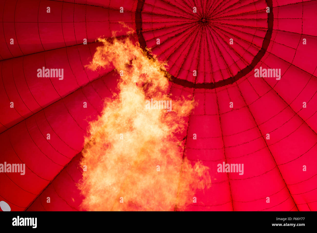 Gas flame heating hot air balloon to help it rise Stock Photo - Alamy