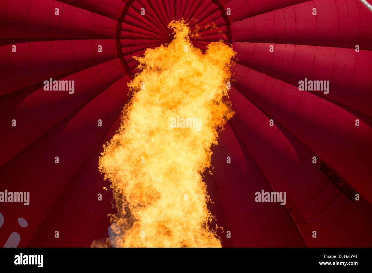 Gas flame heating hot air balloon to help it rise Stock Photo - Alamy