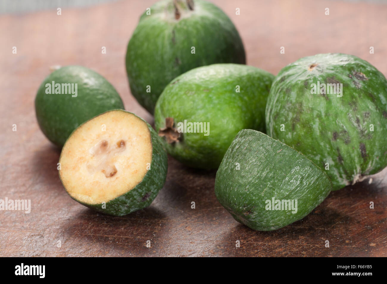 Feijoa berries on a timber board, closeup Stock Photo - Alamy
