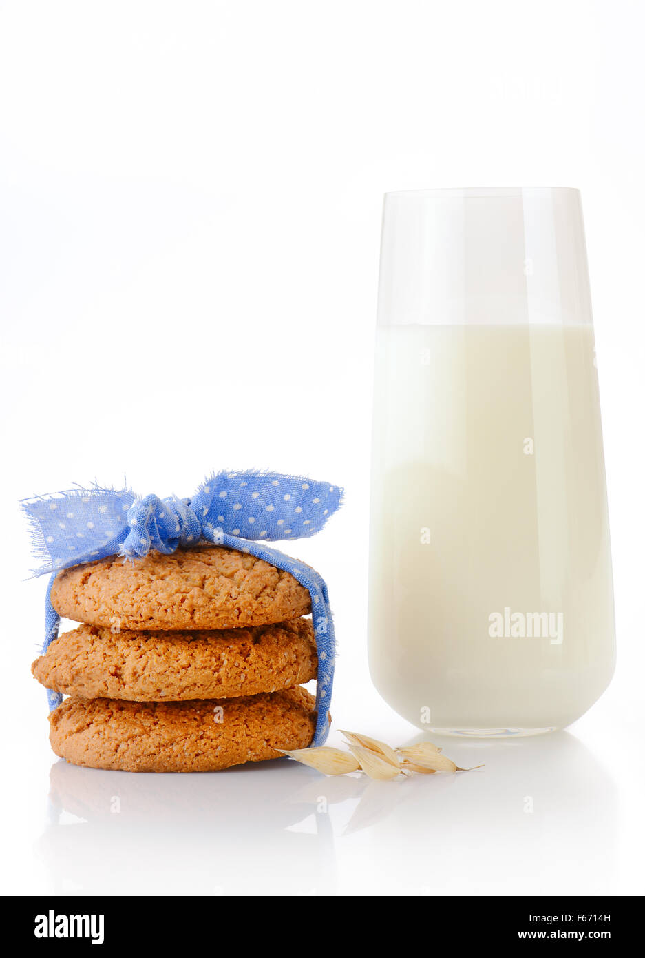 Stack of three homemade oatmeal cookies tied with blue ribbon in small ...