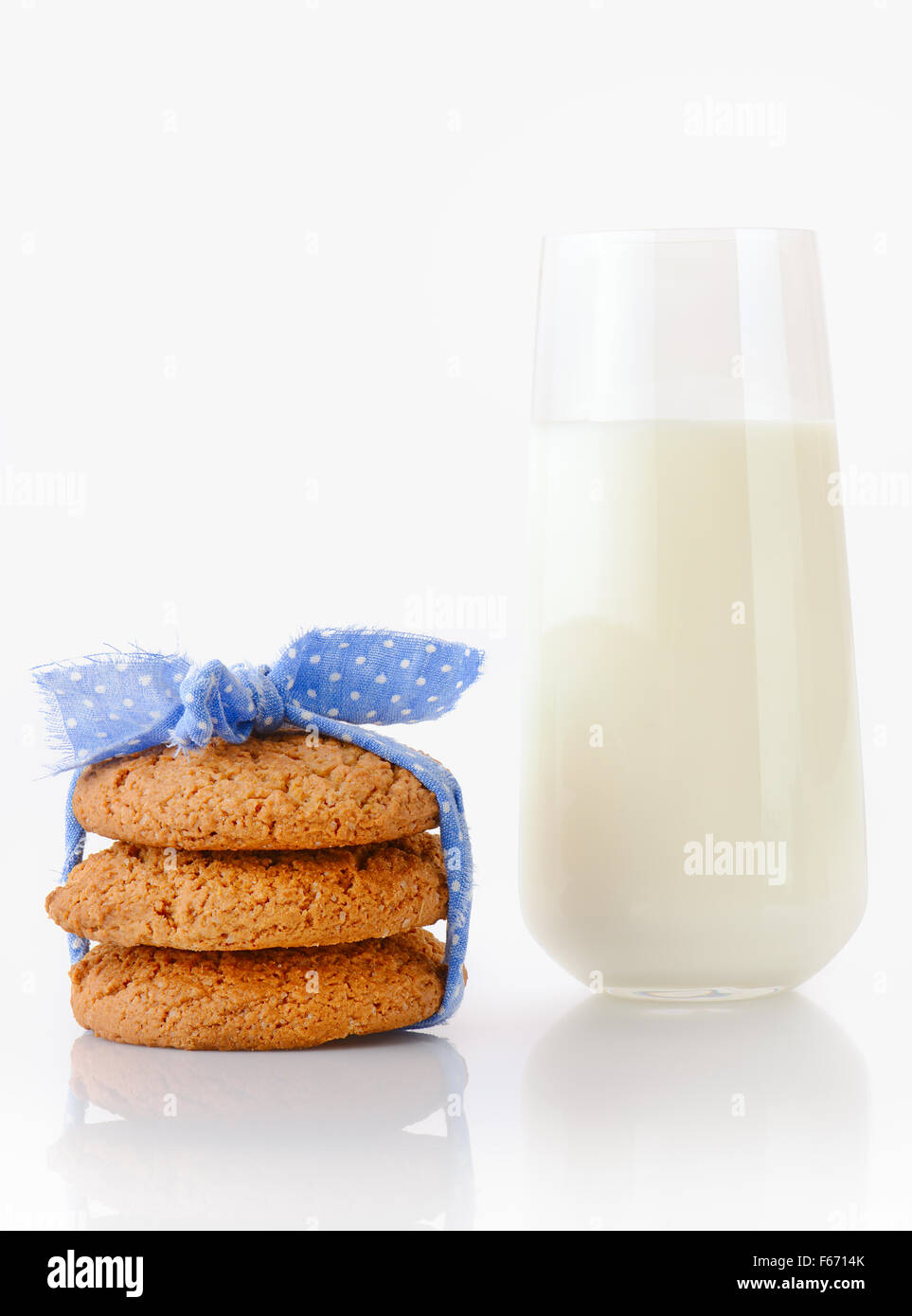 Stack of three homemade oatmeal cookies tied with blue ribbon in small ...