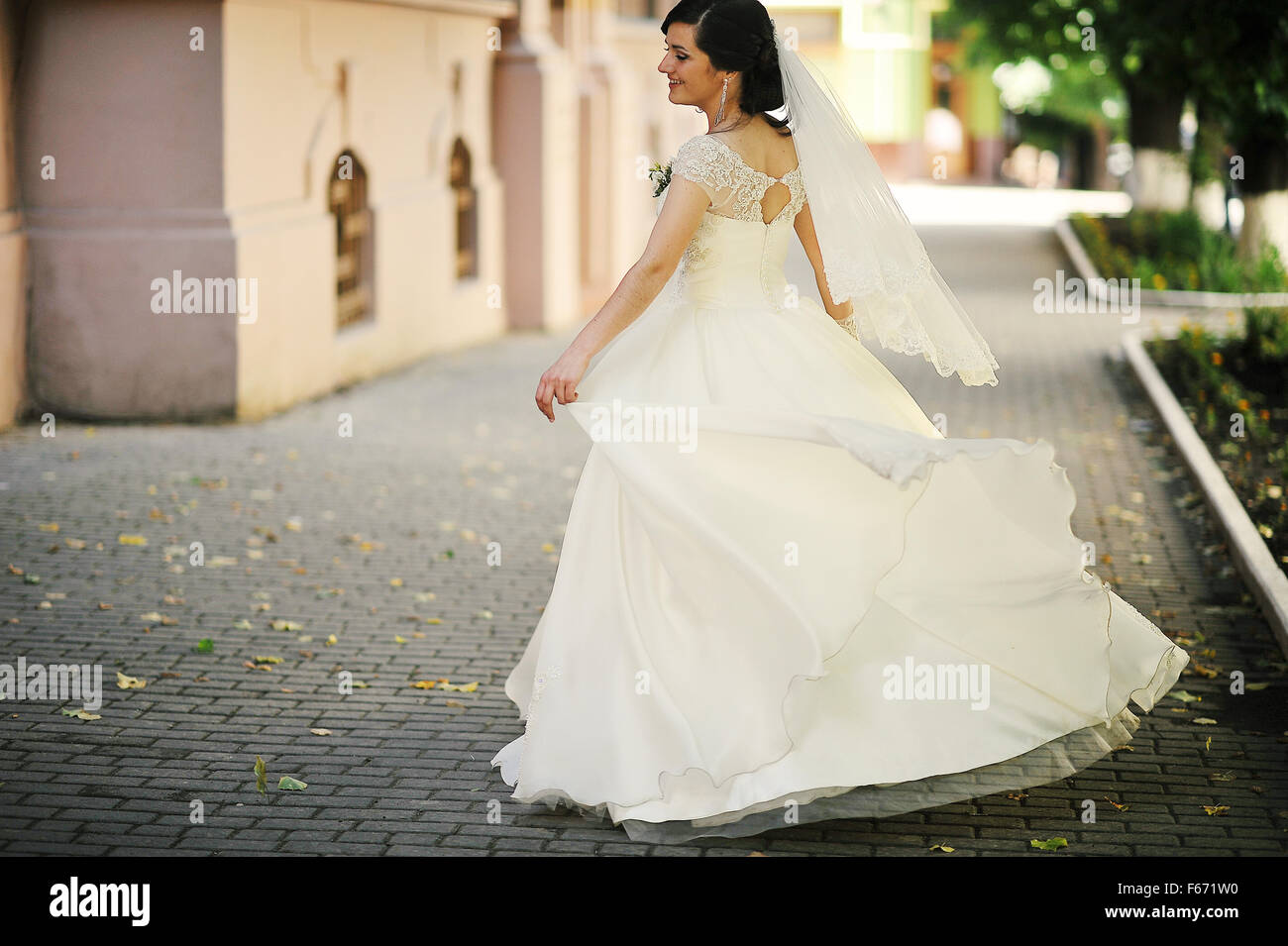 Happy bride dancing Stock Photo - Alamy