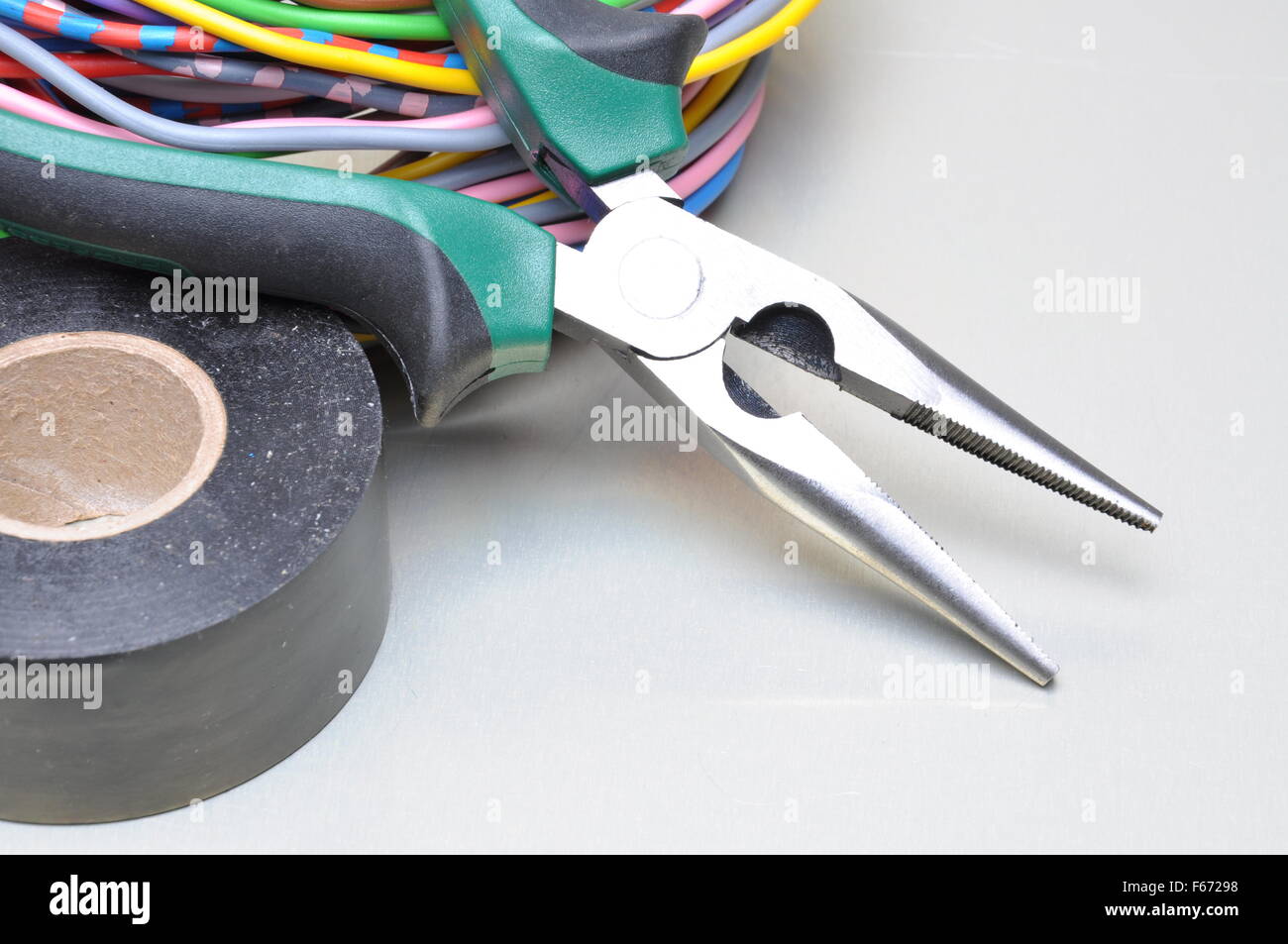 Electrical tools and cables on metal surface Stock Photo - Alamy