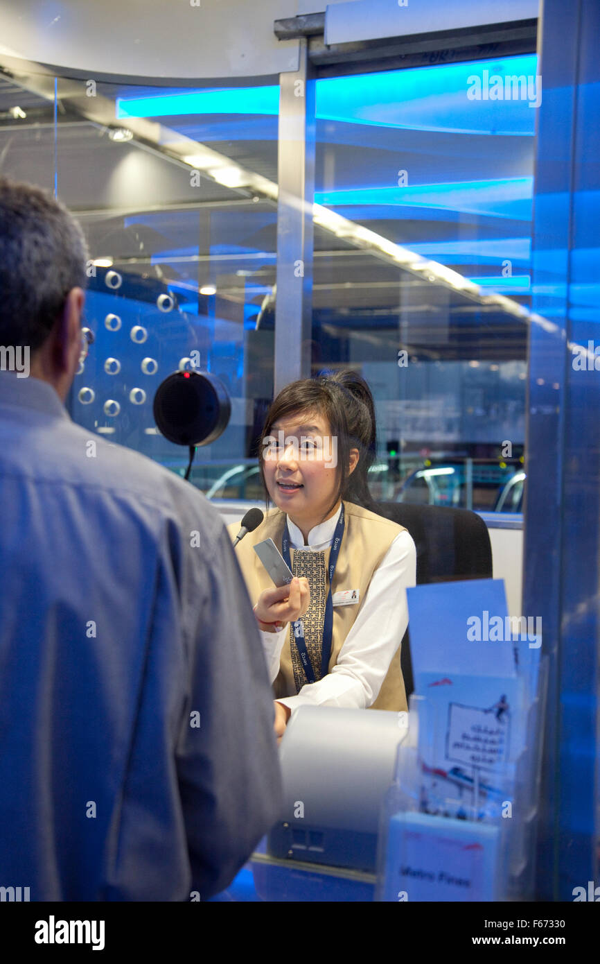 Dubai Metro ticket office showing female member of staff Stock Photo ...