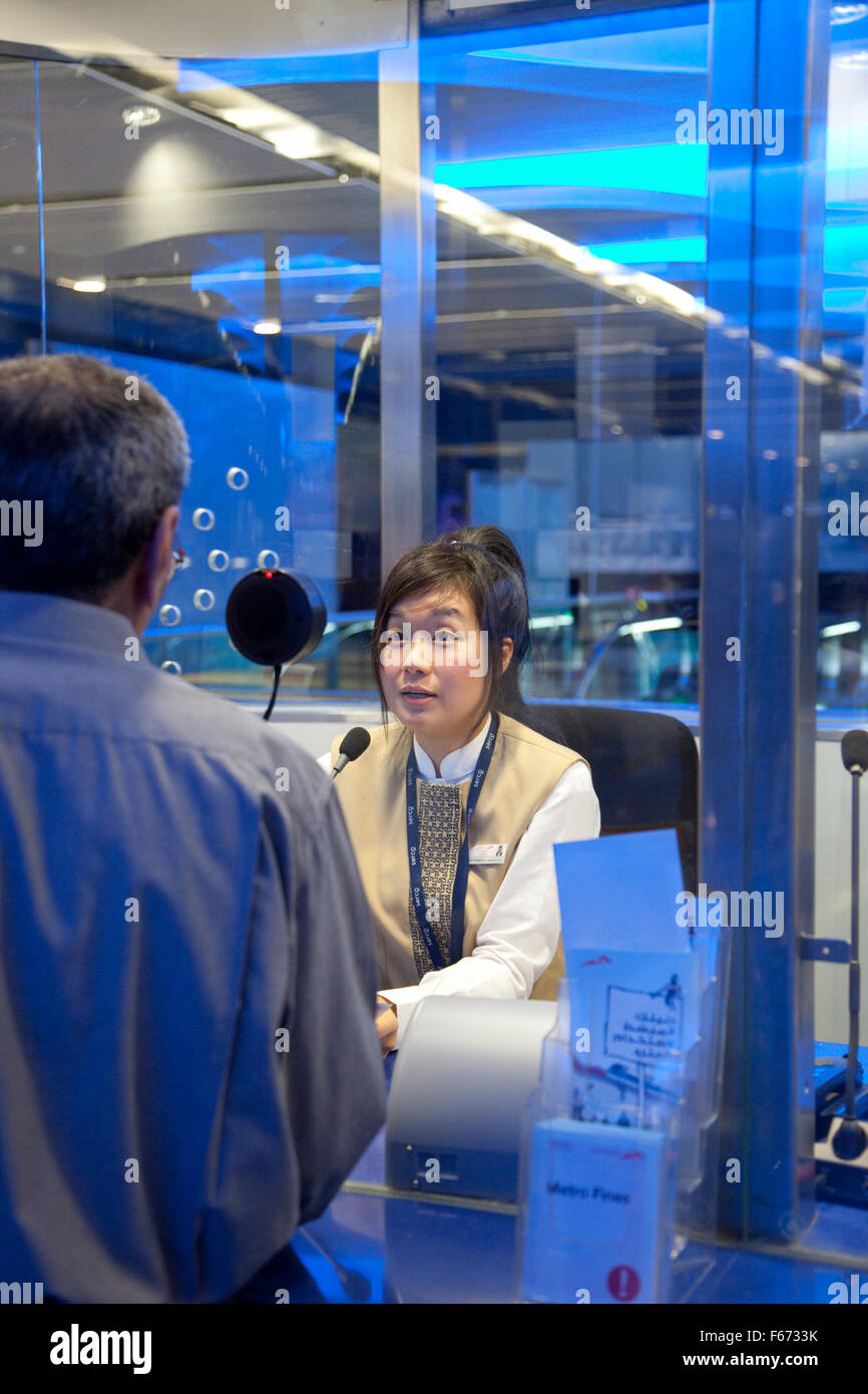 Dubai Metro ticket office showing female member of staff Stock Photo ...