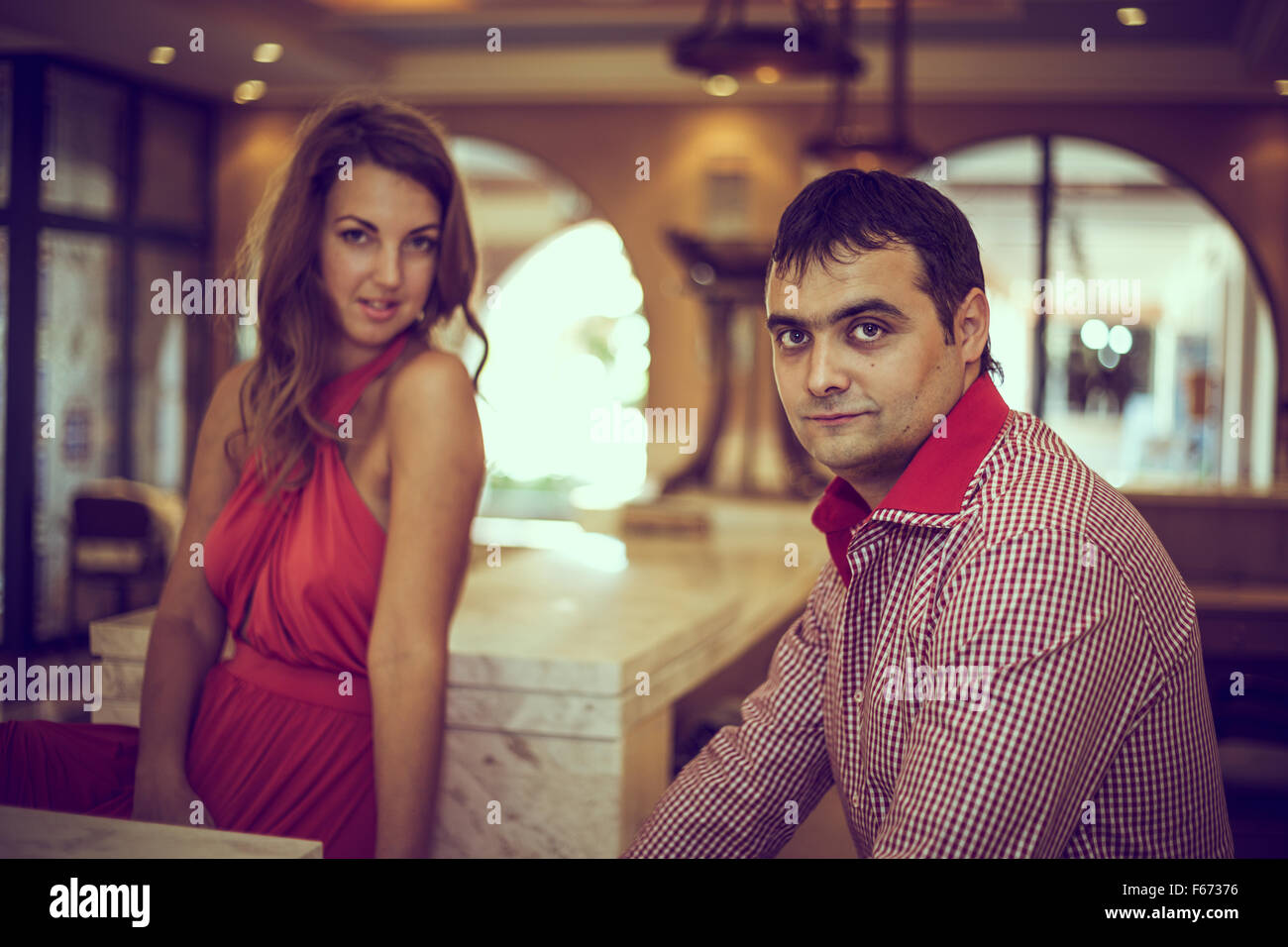 enamored couple posing in a hall Stock Photo - Alamy