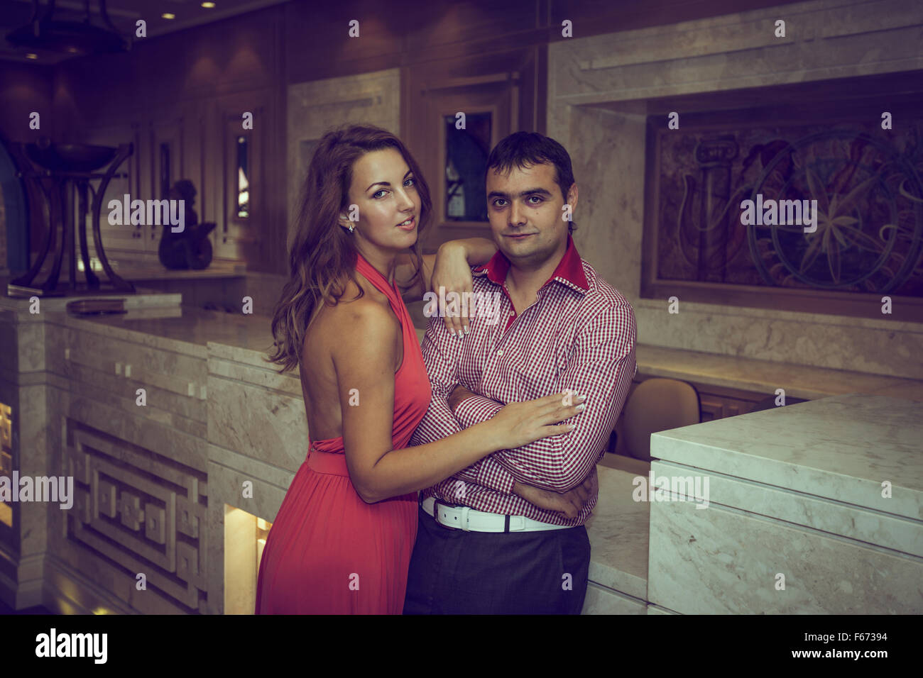 enamored couple posing in a hall Stock Photo - Alamy