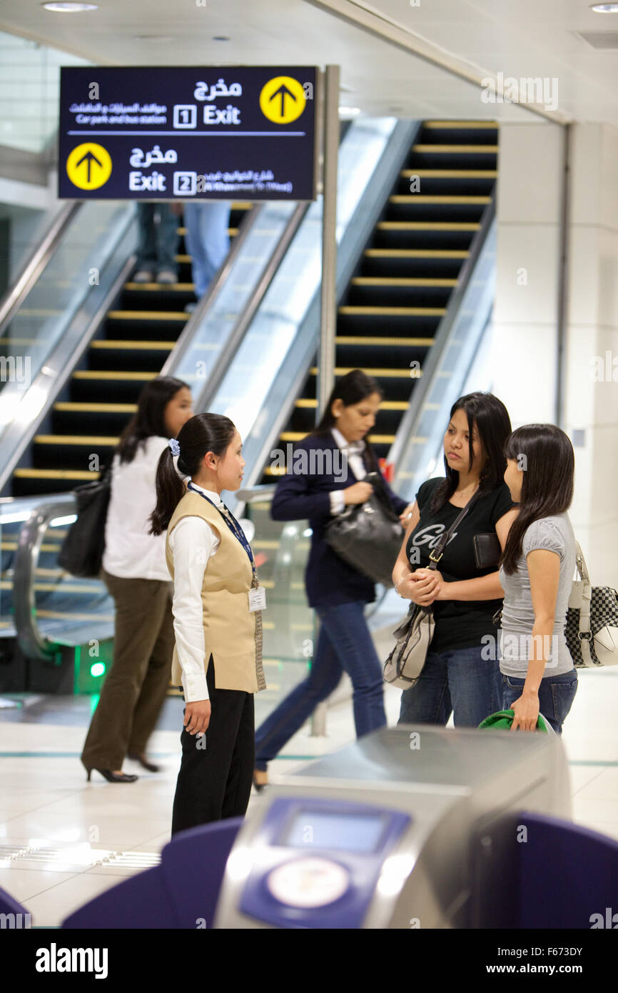 Station staff assist the public in the Dubai Metro Stock Photo - Alamy