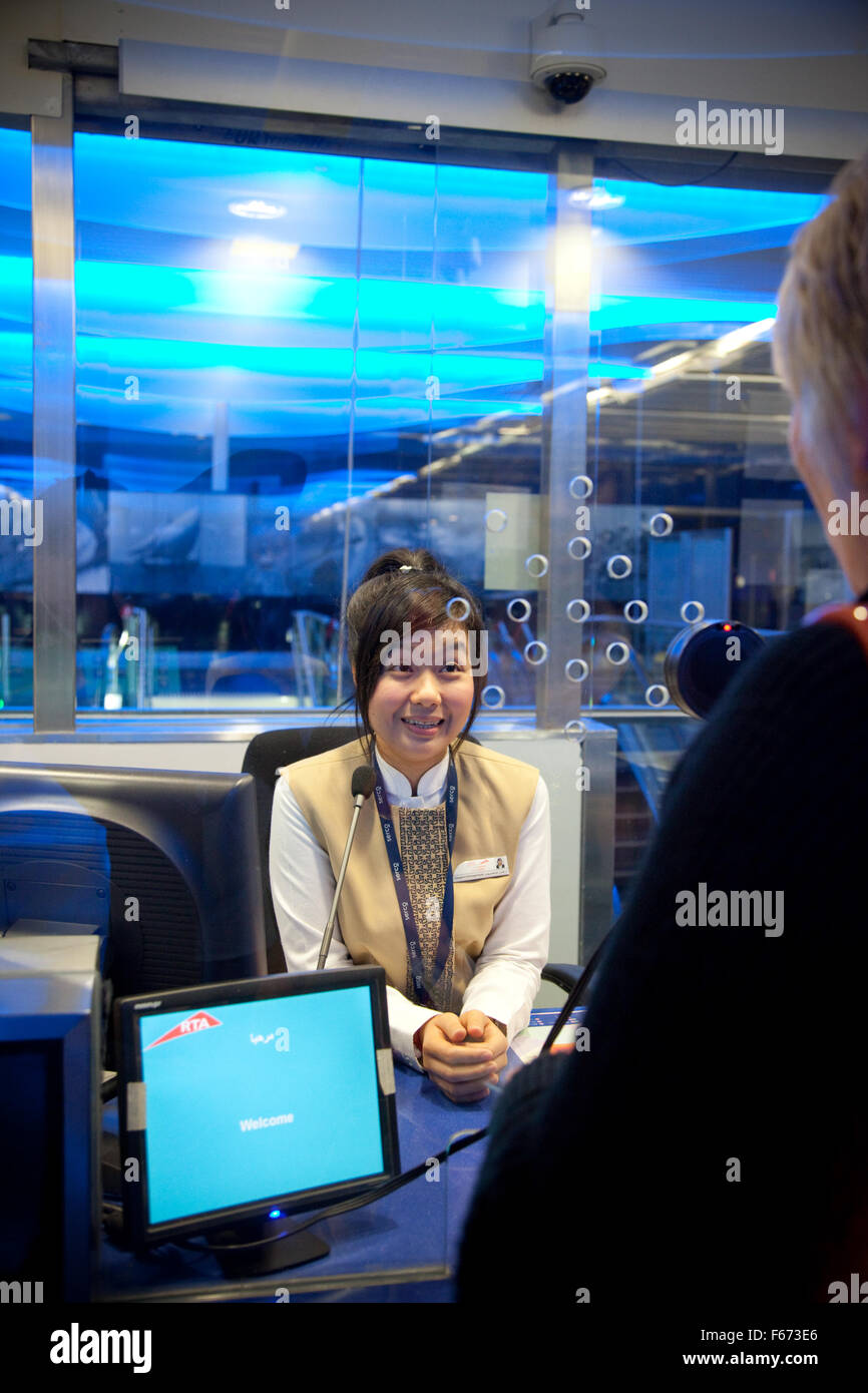 Ticket sales office staff in the Dubai Metro Stock Photo - Alamy