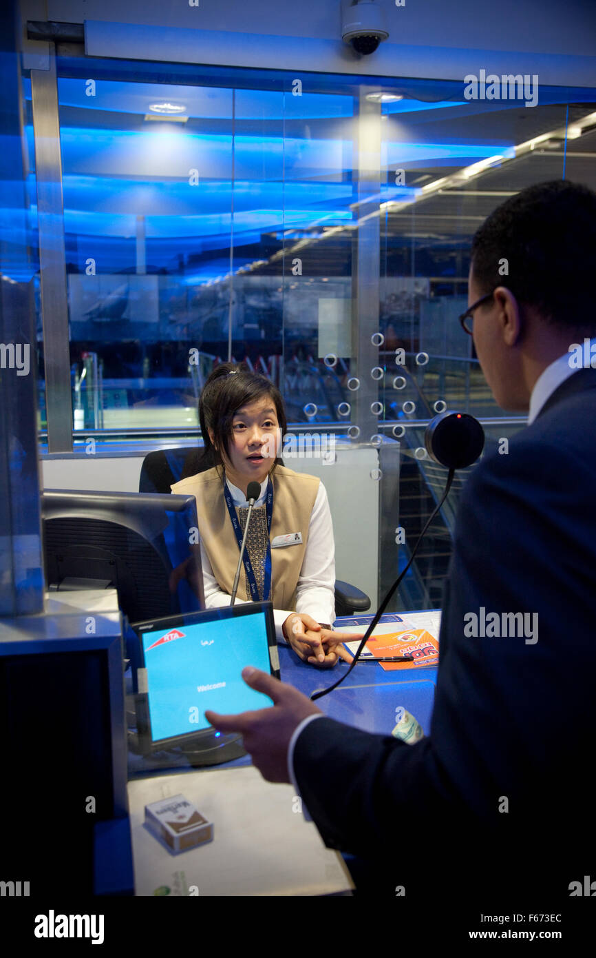 Ticket sales office staff in the Dubai Metro Stock Photo - Alamy