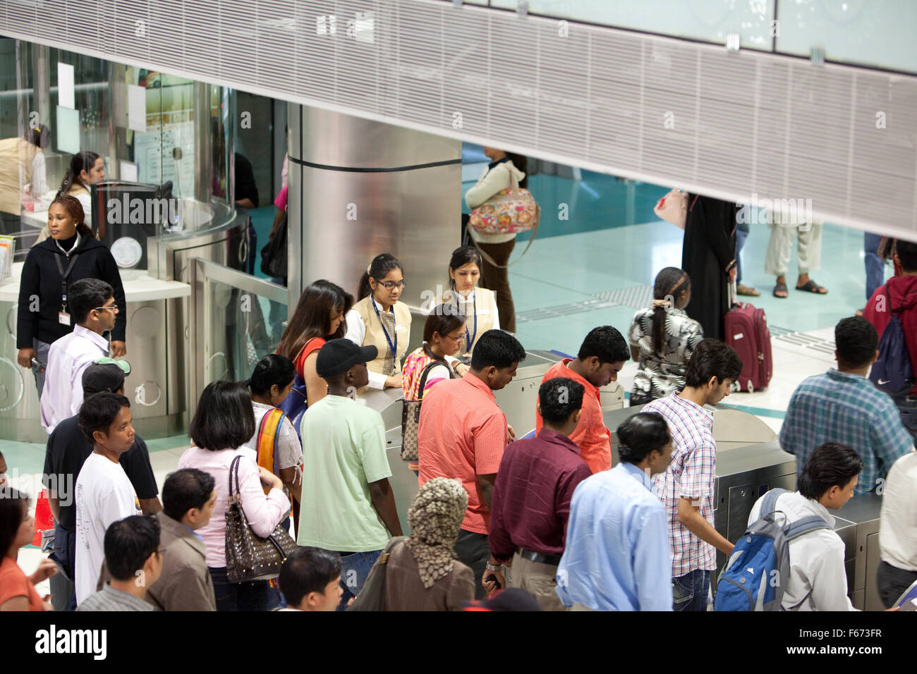 Dubai Metro station staff attending to the public Stock Photo - Alamy